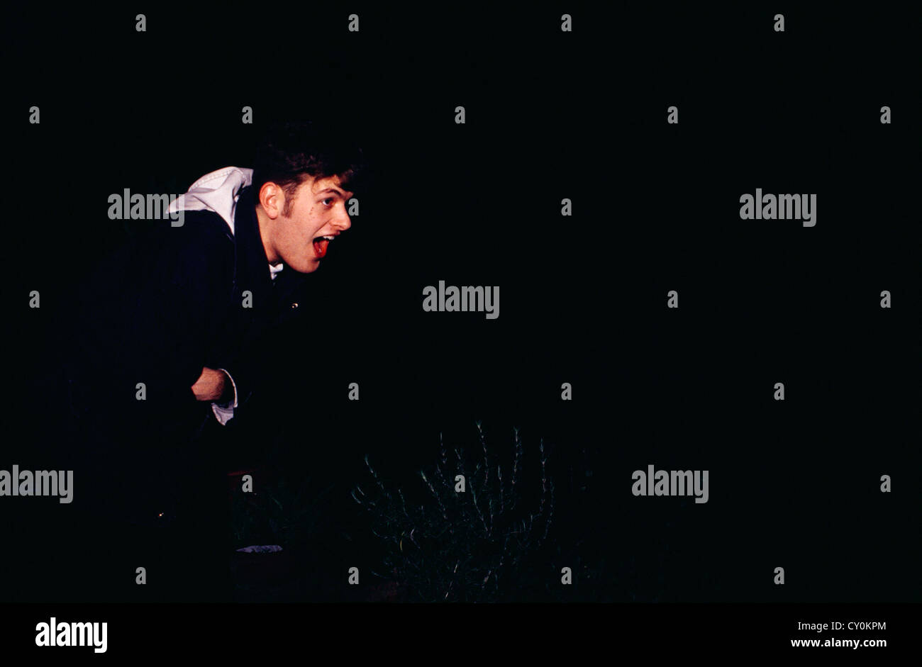 Man Screaming Outside At Night Stock Photo - Alamy