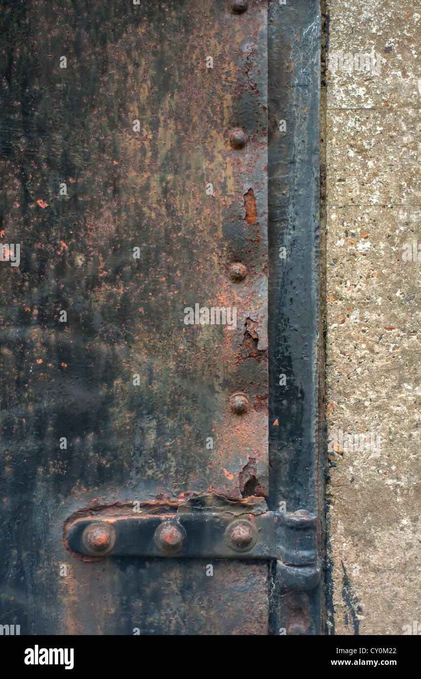 Hinge of a Rusted Metal Black Door Stock Photo - Alamy