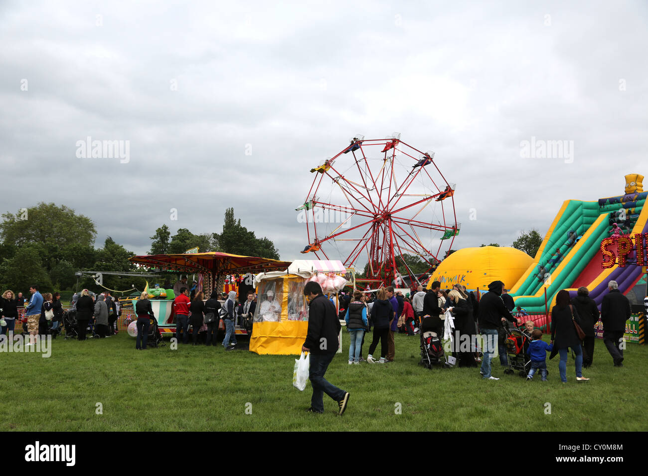 Crowds Walking Around Rides At Cheam Village Fair Surrey England Stock ...