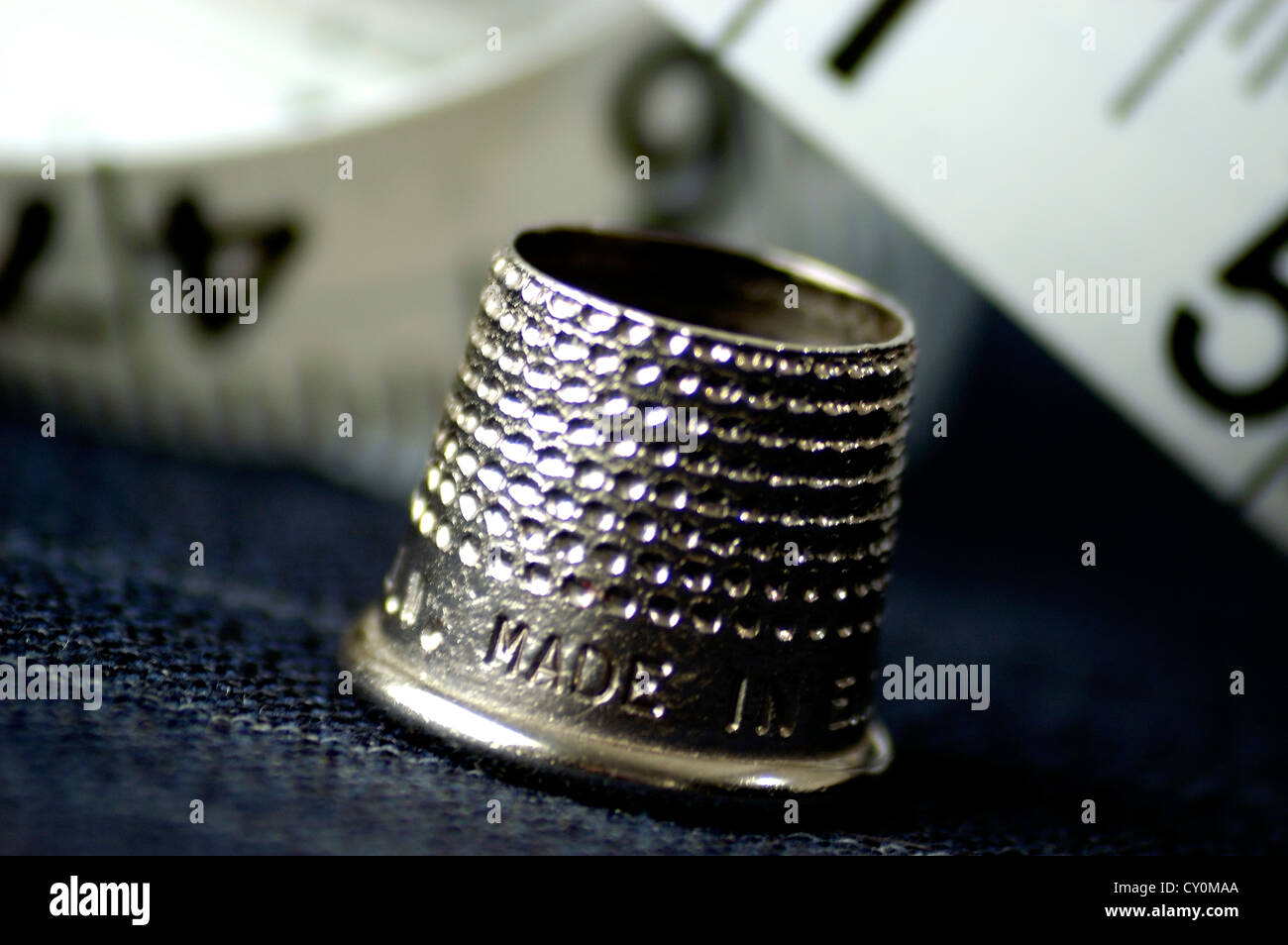 Thimble and Tape Measure Stock Photo - Alamy