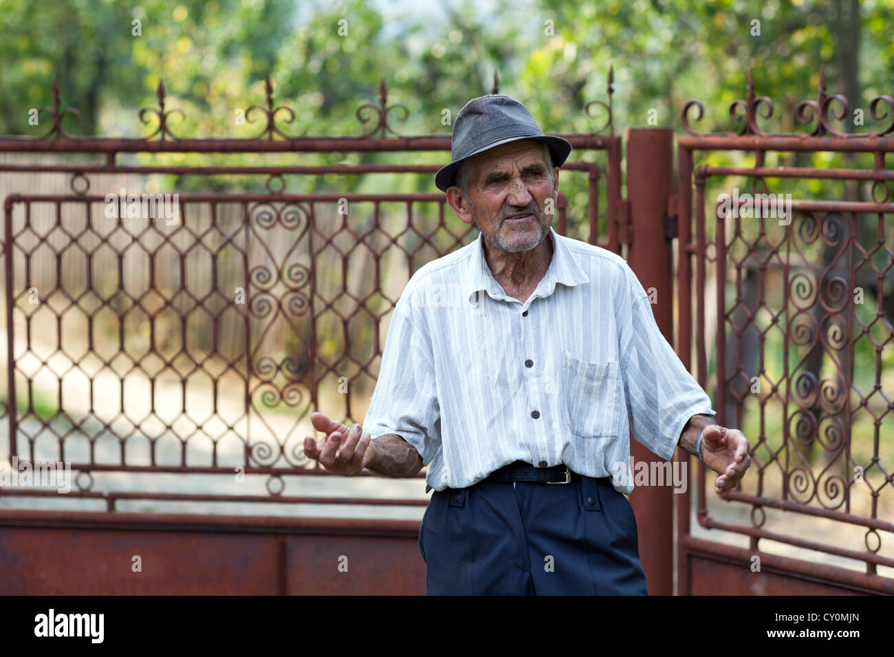 Man standing outside gate hi-res stock photography and images - Alamy