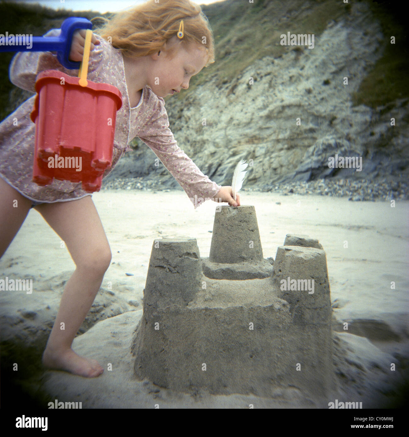 Young Girl Building Sand Castle Stock Photo - Alamy