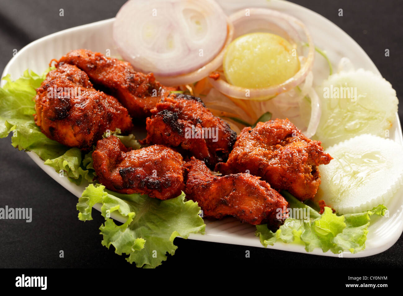 Mutton Tikka is an Indian/Pakistani dish made by baking Mutton which has been marinated in ...