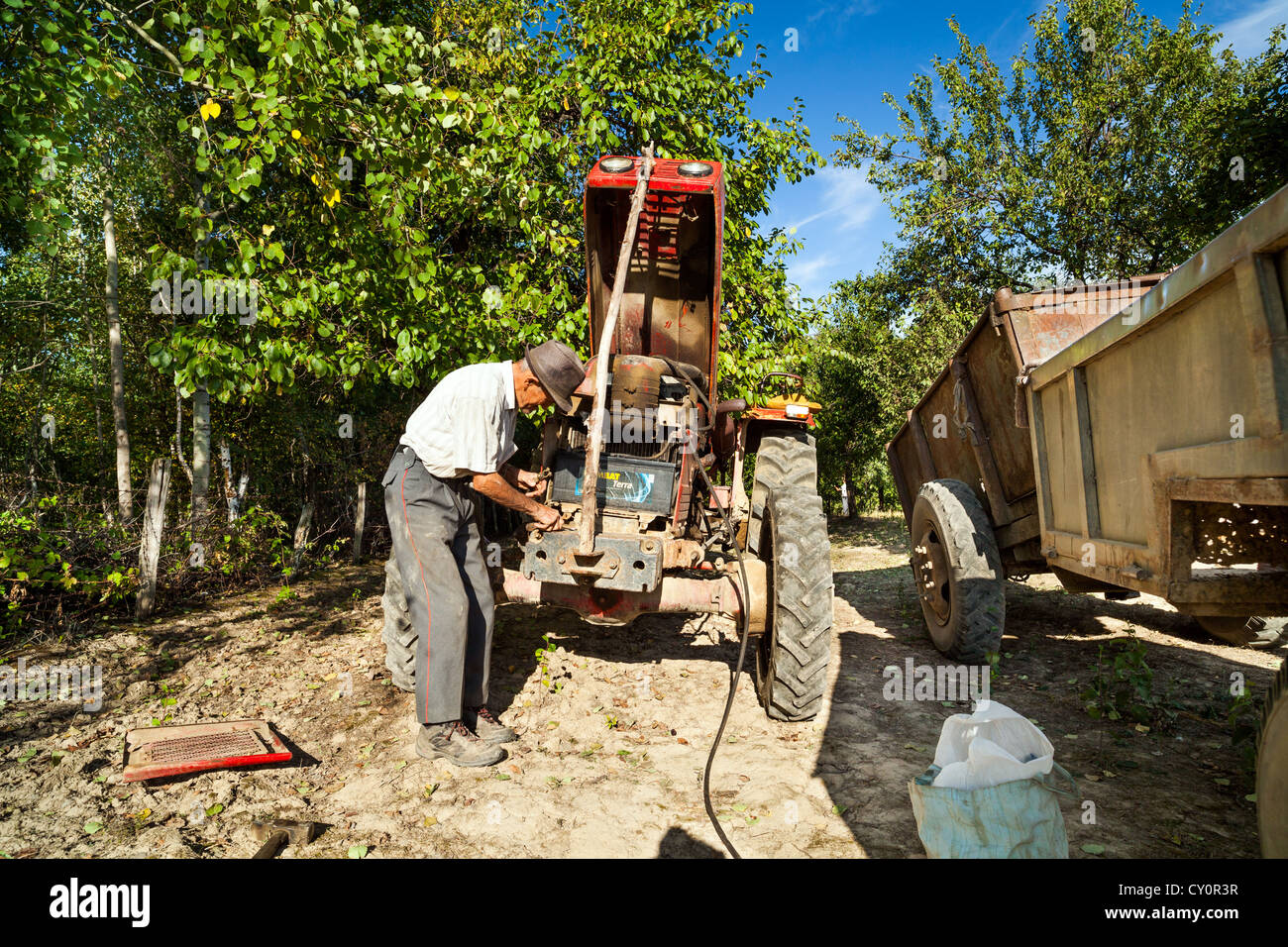 Mechanic repairing tractor hi-res stock photography and images - Alamy