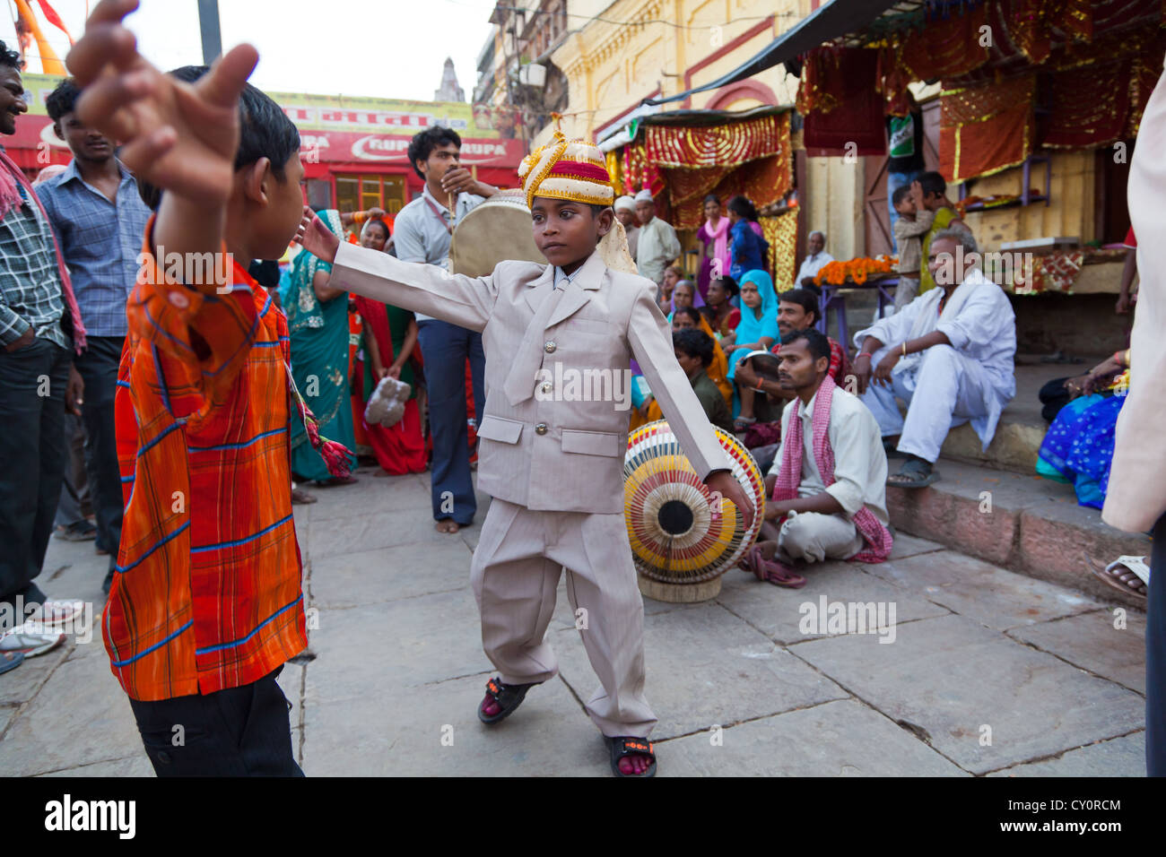 Little boys dancing at a Ceremony on the Ghats of Varanasi, India Stock ...
