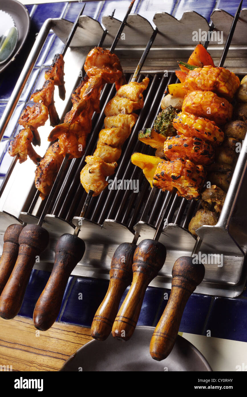 Barbecue Kebab Platter are small pieces of meat on skewers roasted over ...