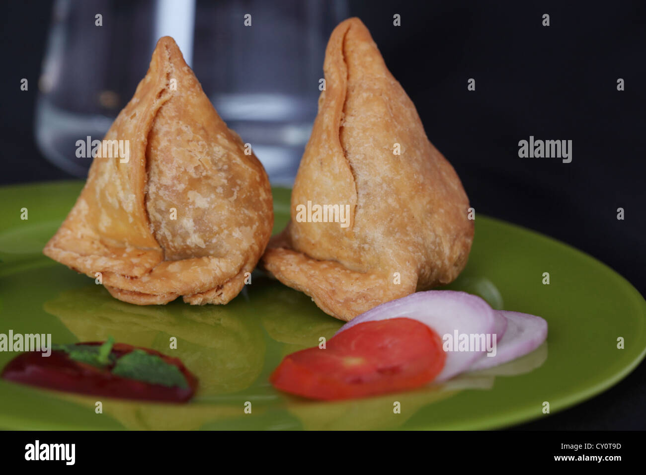 Samosa is an Inidan fried or baked pastry with a savory filling, such ...
