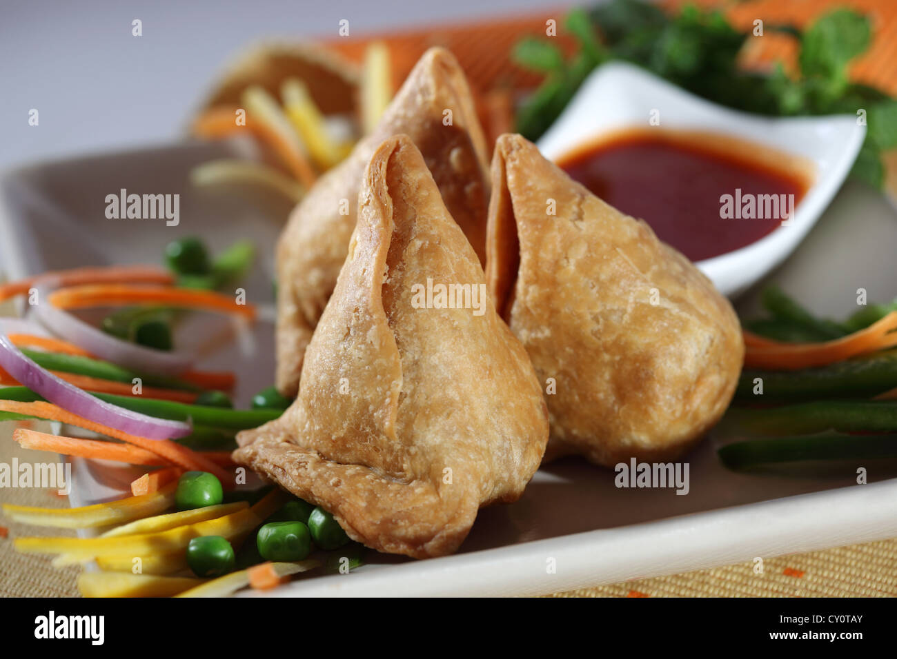 Samosa is an Inidan fried or baked pastry with a savory filling, such ...
