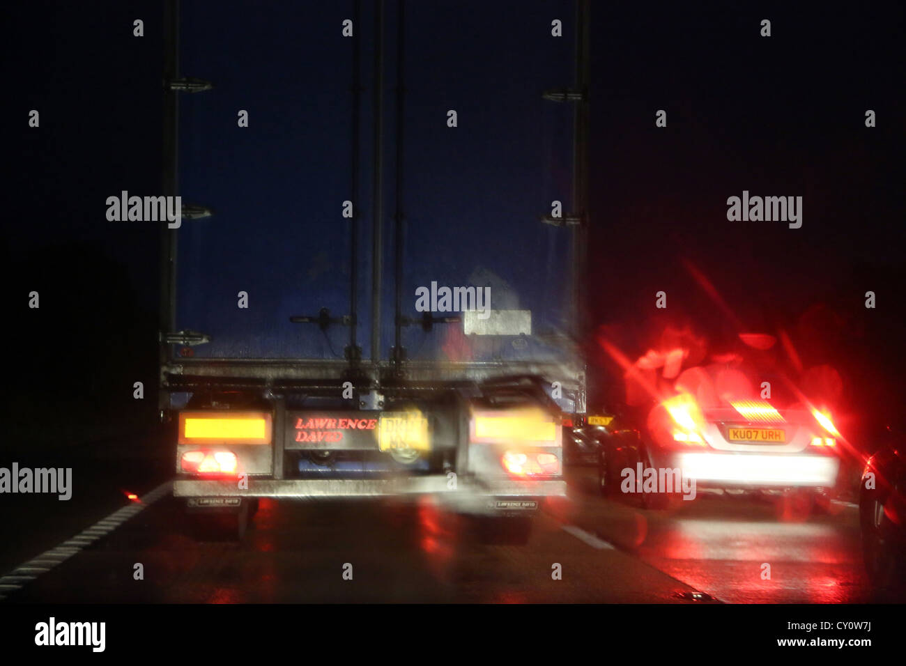Lorry's Tail Lights At Night Taken Through Car Windscreen In The Rain ...