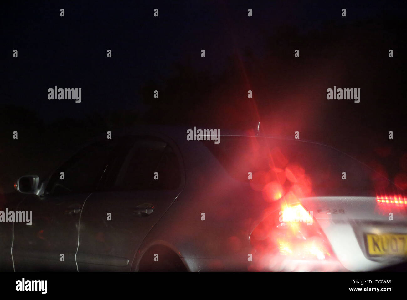 CarTail Lights At Night Taken Through Car Windscreen In The Rain On ...