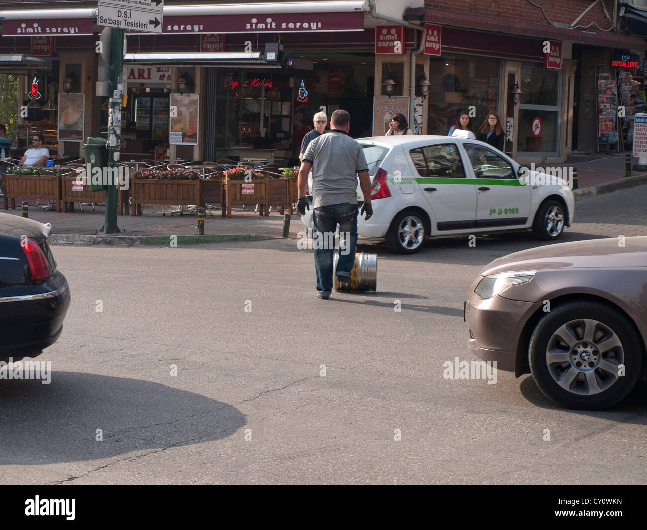 Beer transport on a street corner in Bursa Turkey, rolling and kicking ...