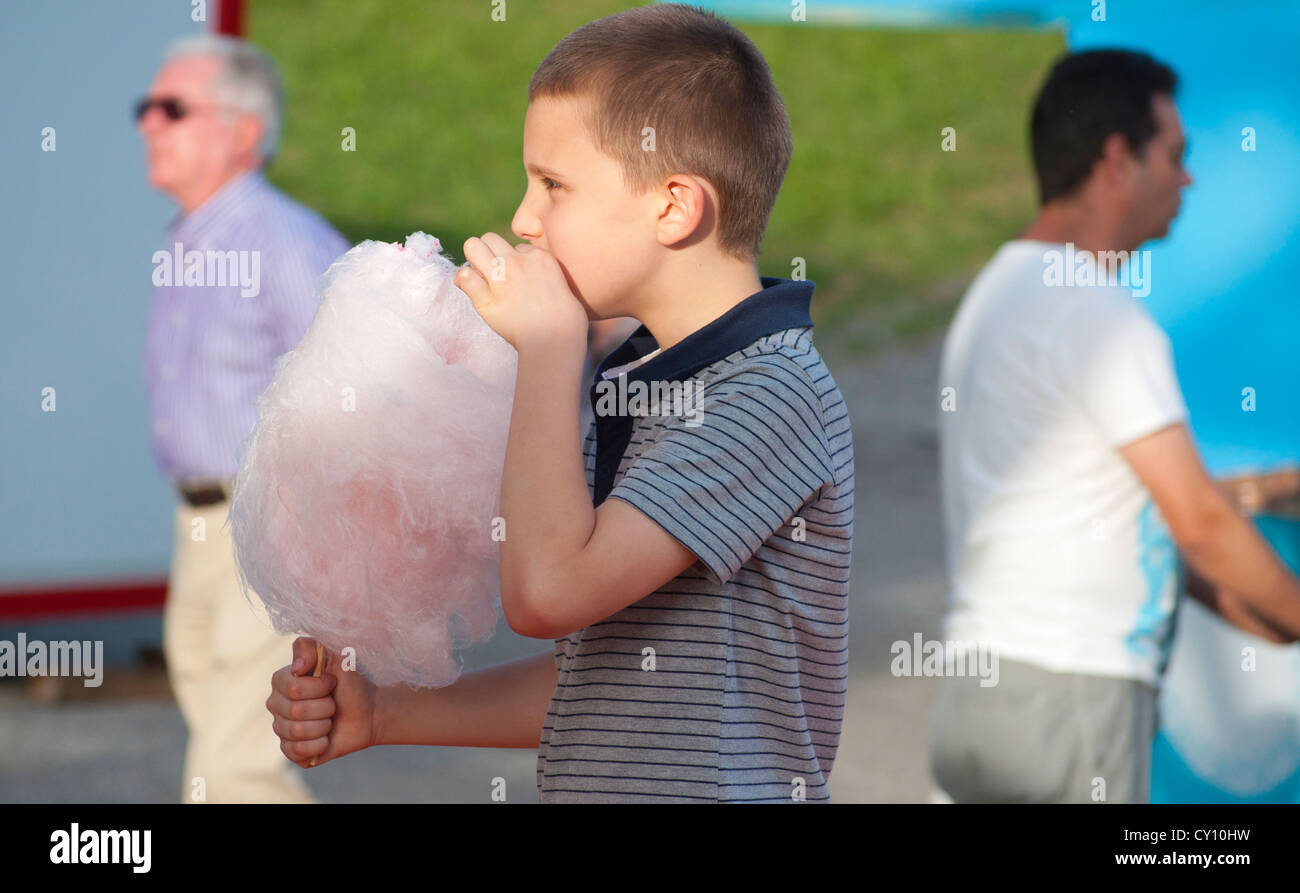 Boy eating candy floss at book fair, Lisbon, Portugal Stock Photo - Alamy