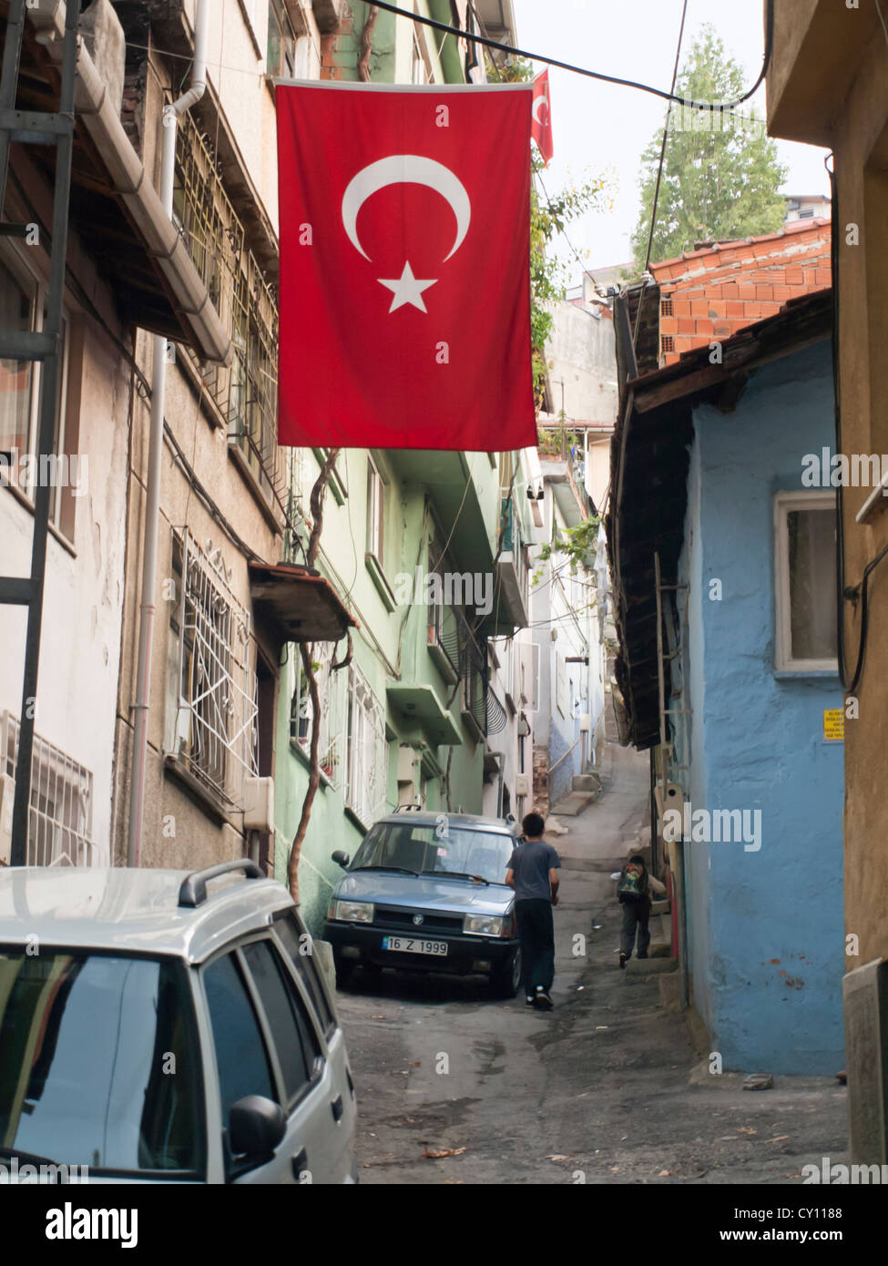 Streets in the Tophane district of Bursa Turkey, Turkish flag waving in ...