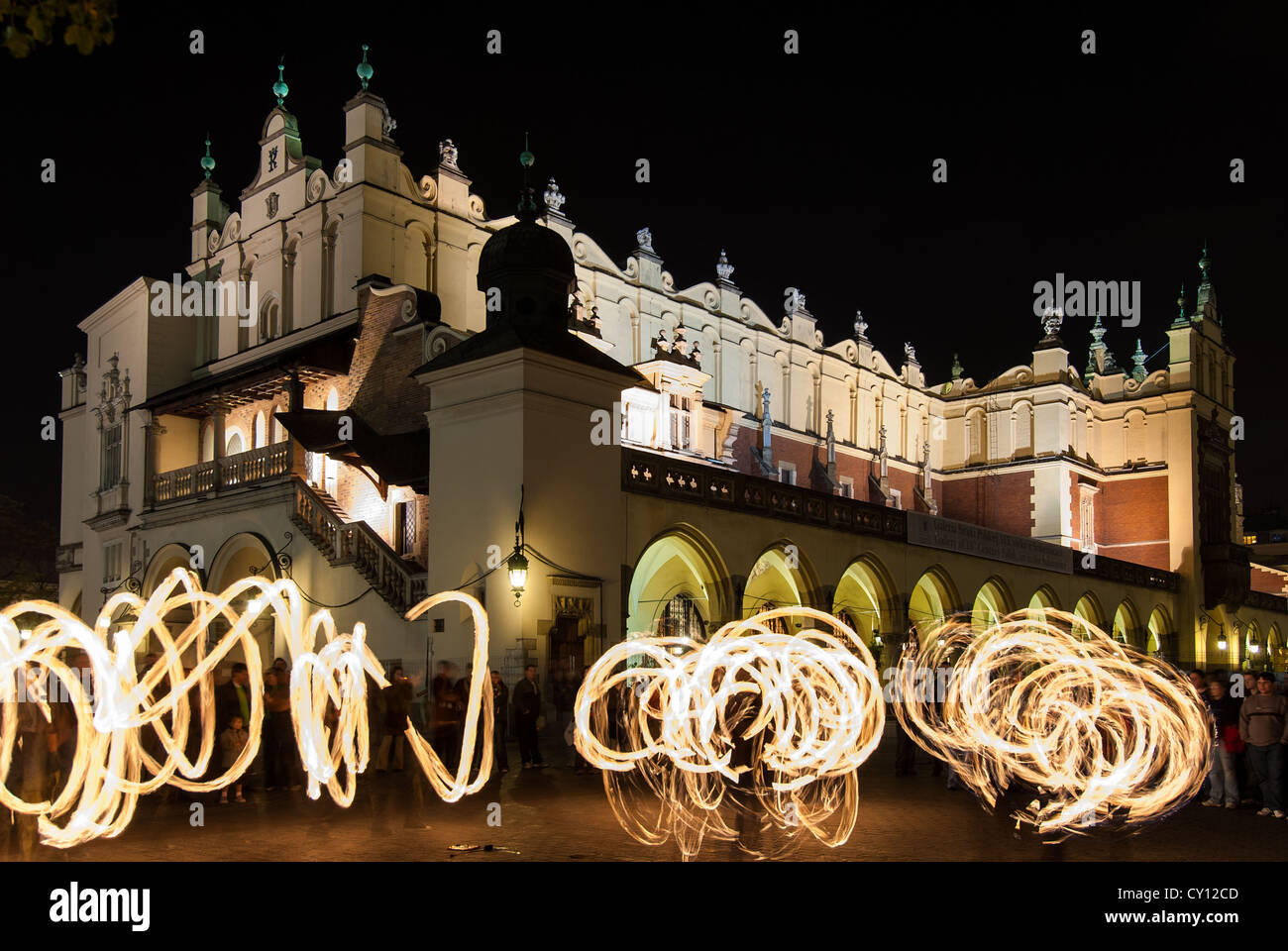 A group of jugglers present a fire show near the Cloth Hall at the Main ...
