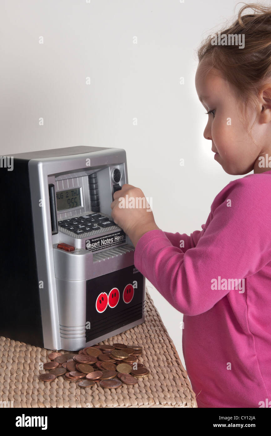 little girl playing on toy cash register Stock Photo - Alamy