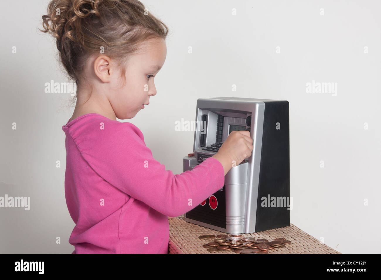 little girl playing on toy cash register Stock Photo - Alamy