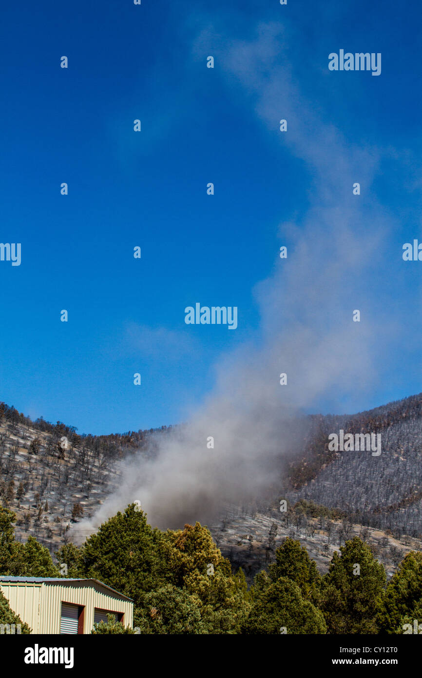 A dust devil made up of ash from a recent forest fire at the named Pine ...
