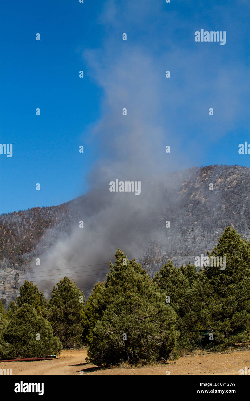 A dust devil made up of ash from a recent forest fire at the named Pine ...