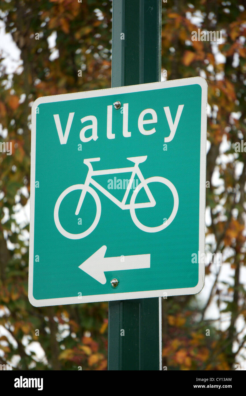 Bicyle path sign with autumn foliage in background, Vancouver, British ...