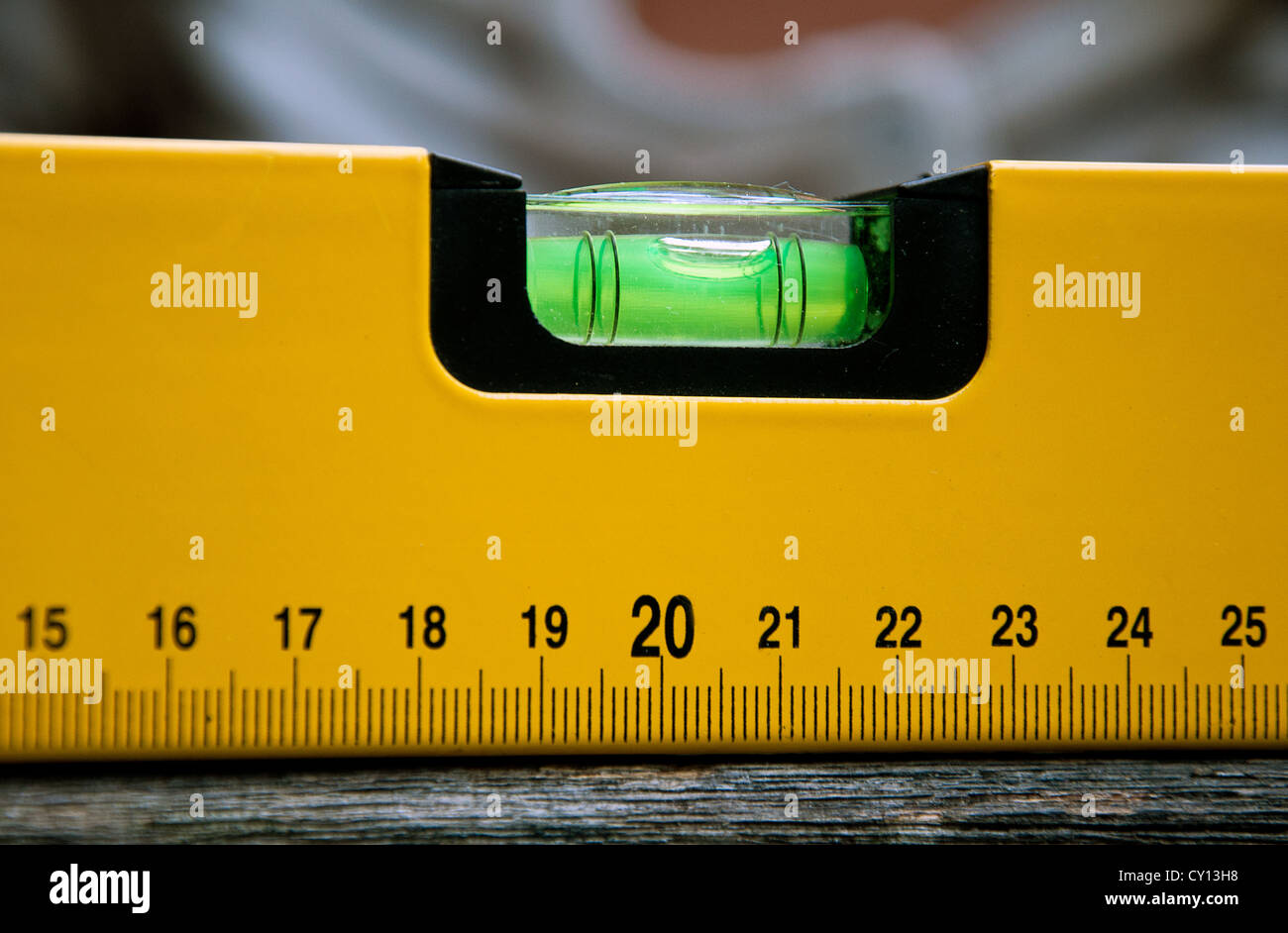 Detail of spirit level on a wooden surface Stock Photo - Alamy