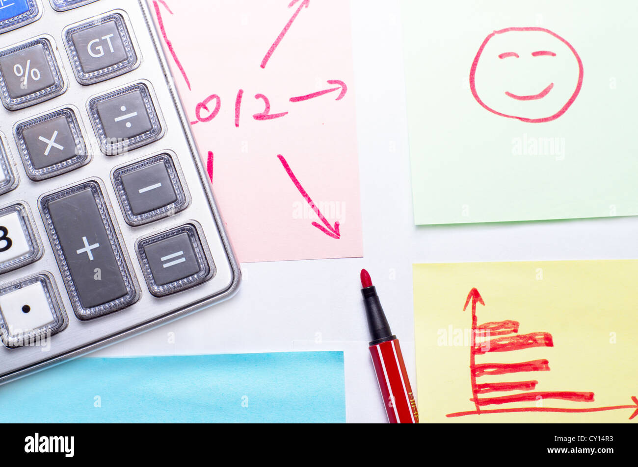 calculator on business newspaper showing chart and graph background ...