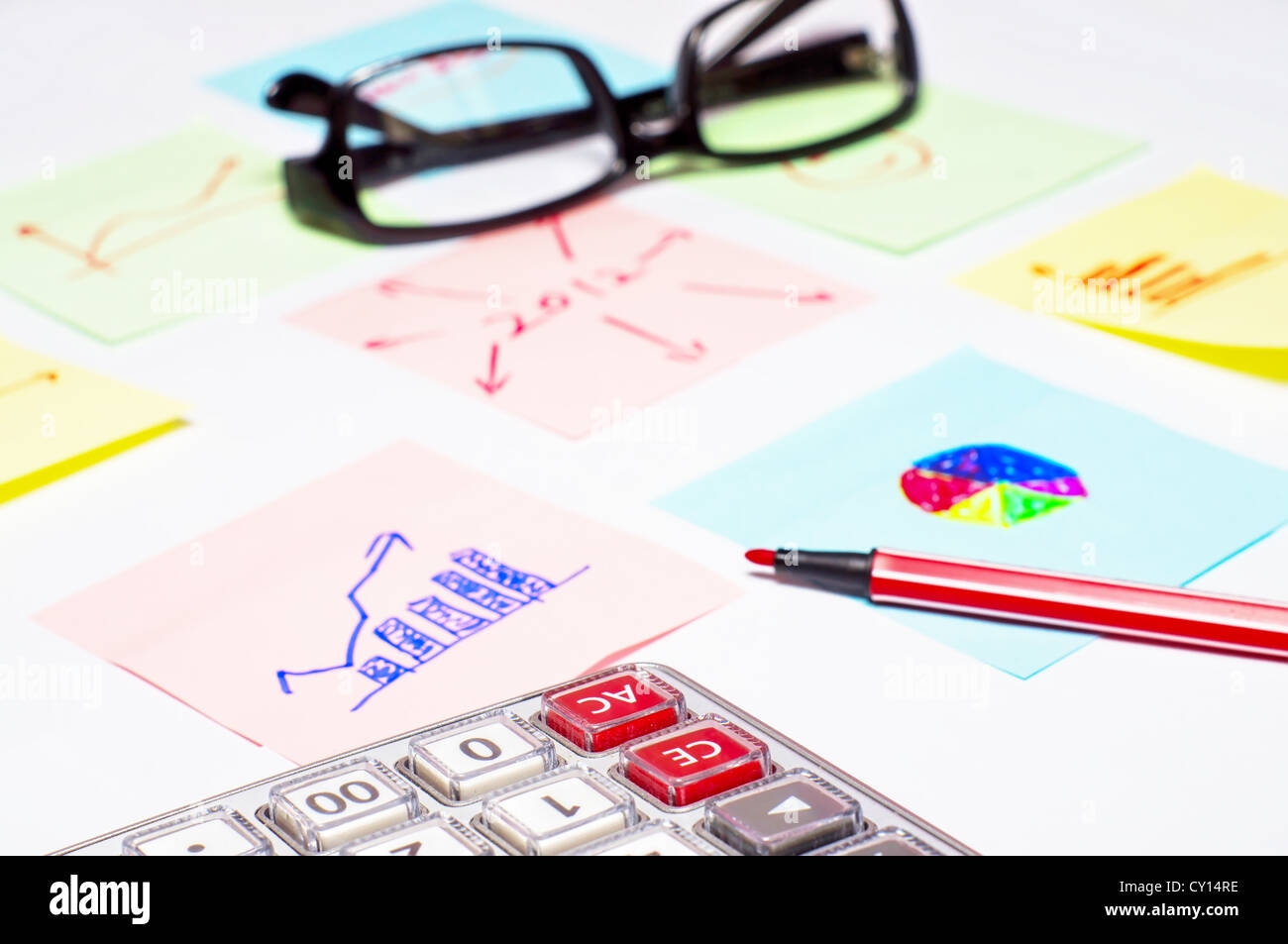 calculator on business newspaper showing chart and graph background ...