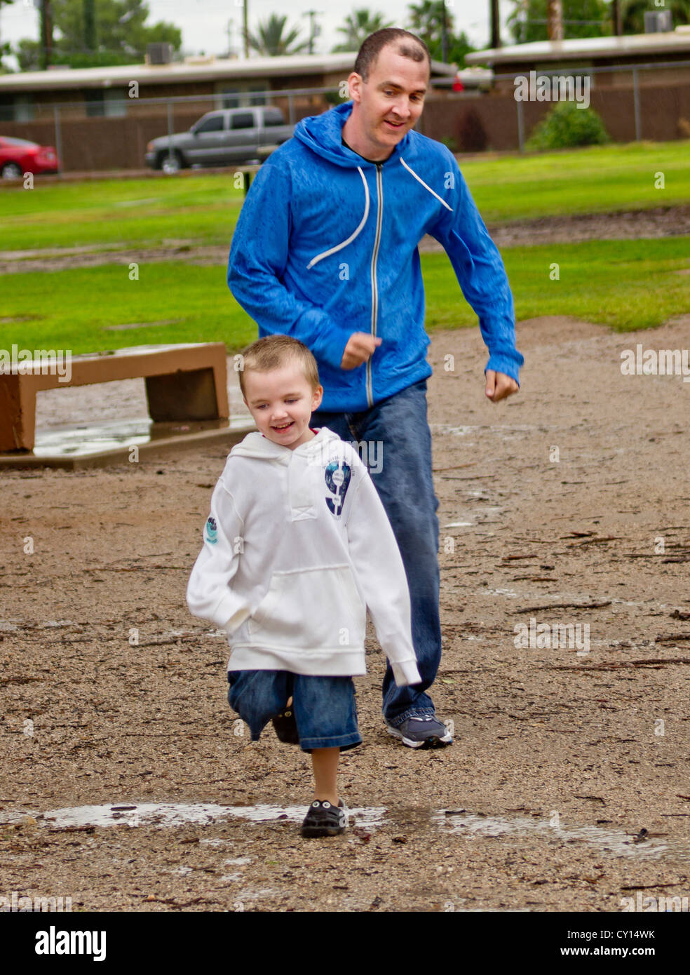 A father engages his five-year-old autistic son in a favorite game of ...