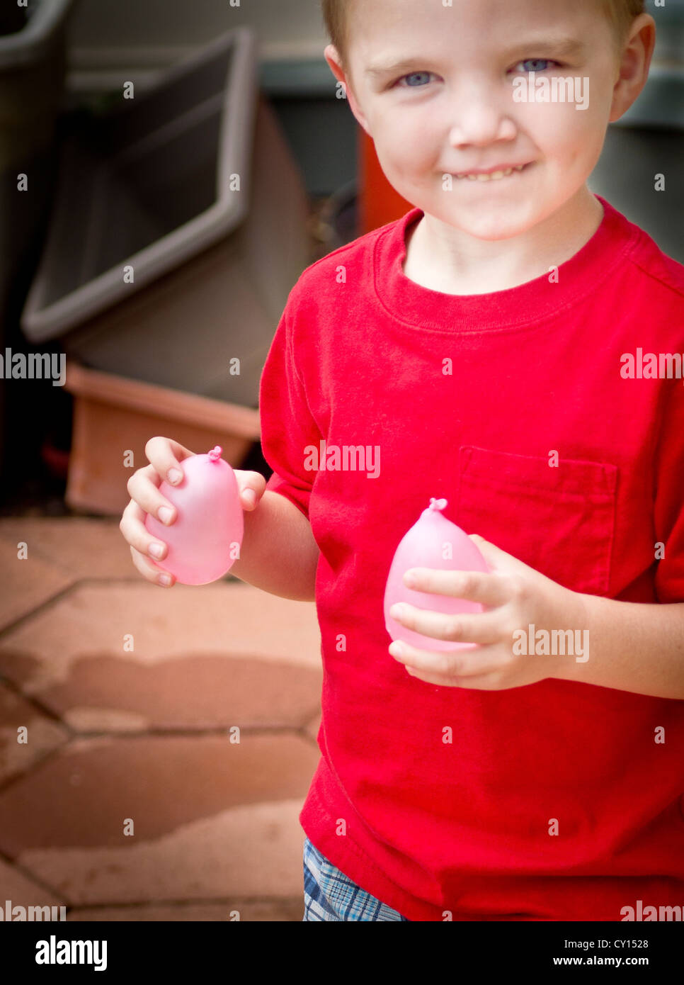 A five-year-old autistic boy plays with water balloons for the first ...