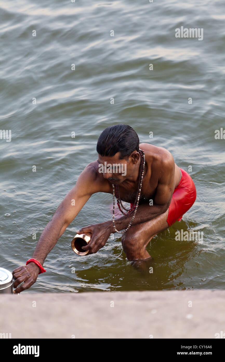 Taking a Bath in the holy River Ganges in Varanasi, India Stock Photo ...