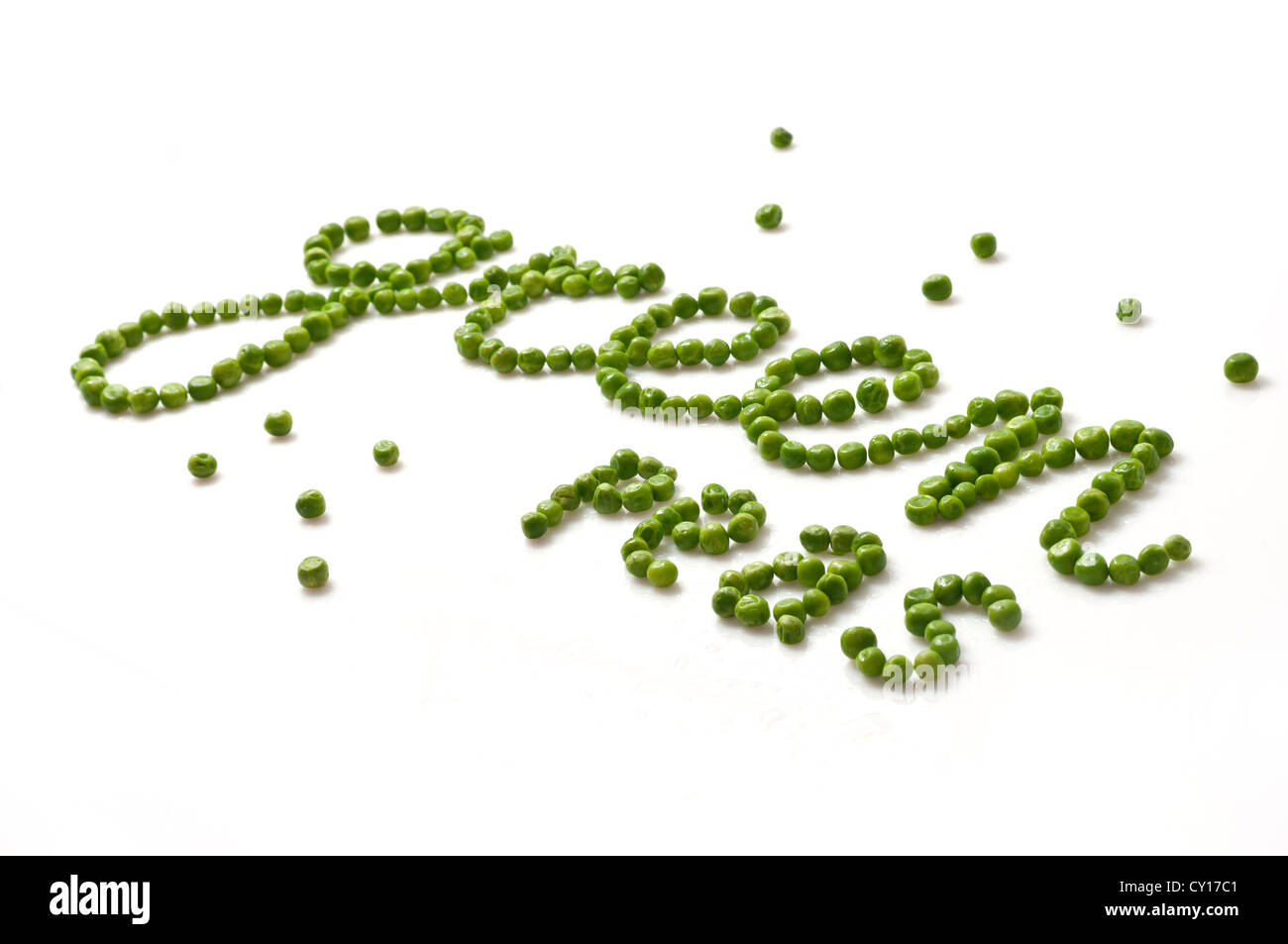 The word GREEN PEAS made of green peas freshed with water drops, studio ...