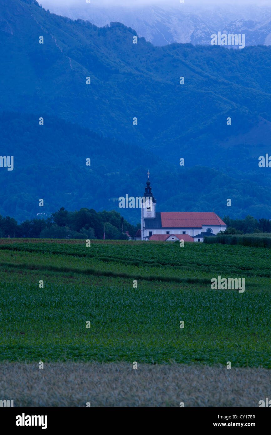 The church of Saint Peter lit at dawn and sitting in the shadow of the ...