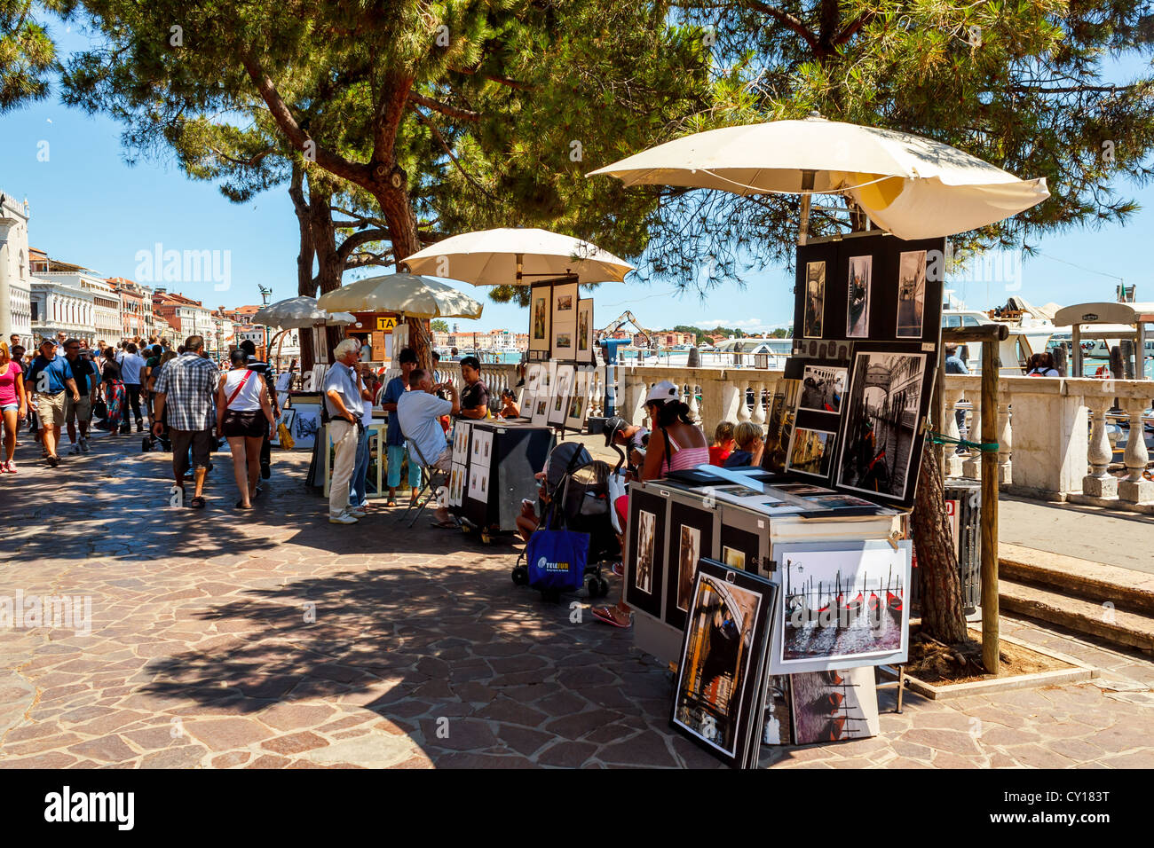 16. July 2012 - Street vendor selling tourist souvenirs. Most vendors in Venice aren't of ...