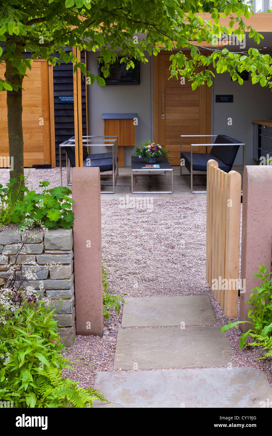 Gateway to relaxing area in contemporary designed garden Stock Photo ...