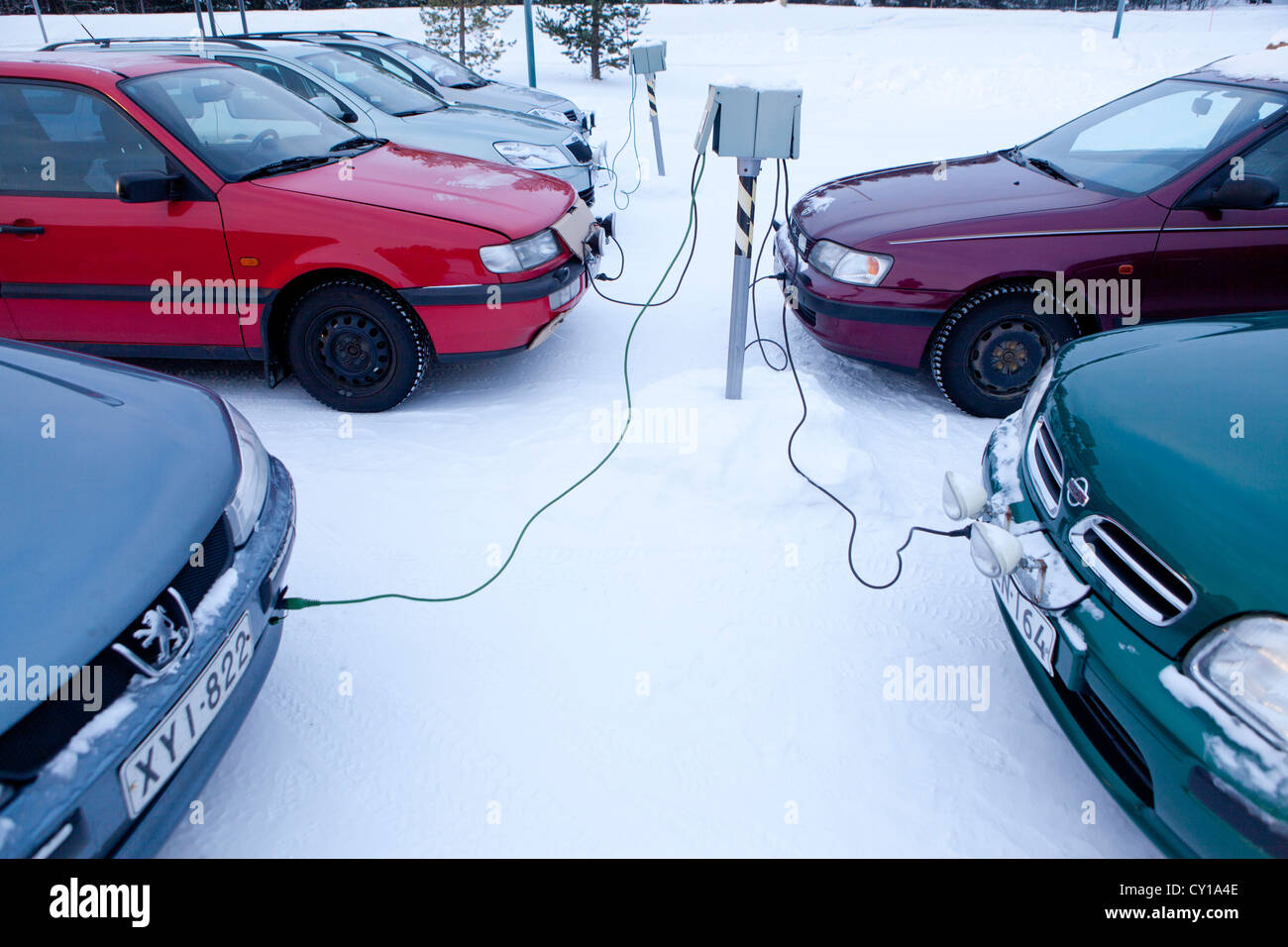 cars being heated by electricty in Finland Stock Photo - Alamy