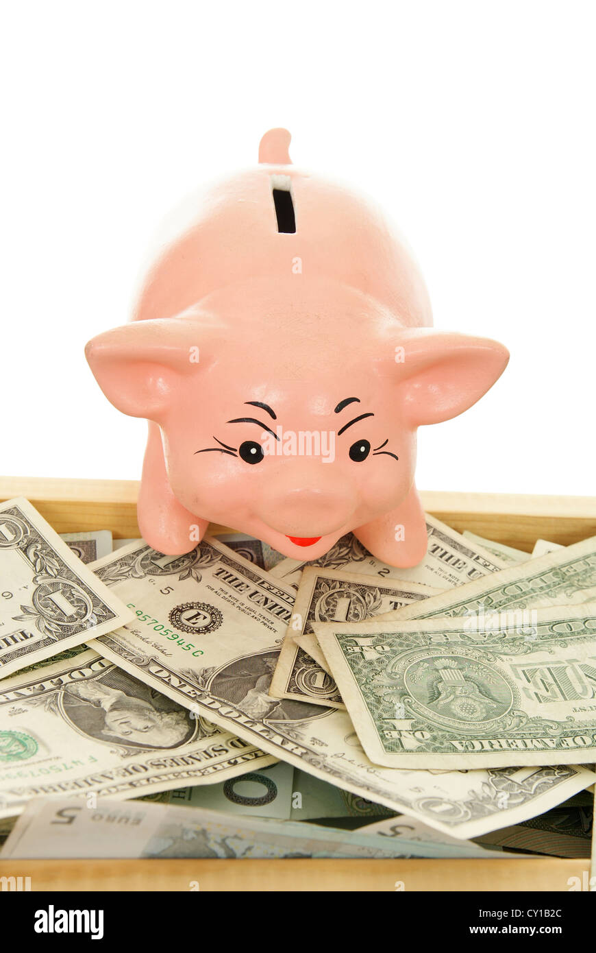 pink piggy near trough with money on white background Stock Photo - Alamy