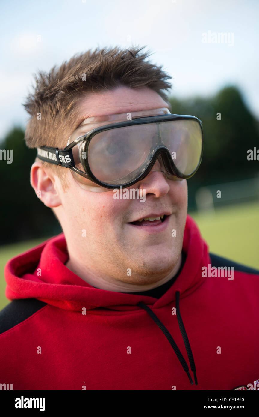 A young man wearing 'beer goggles' designed to mimic the effect of ...