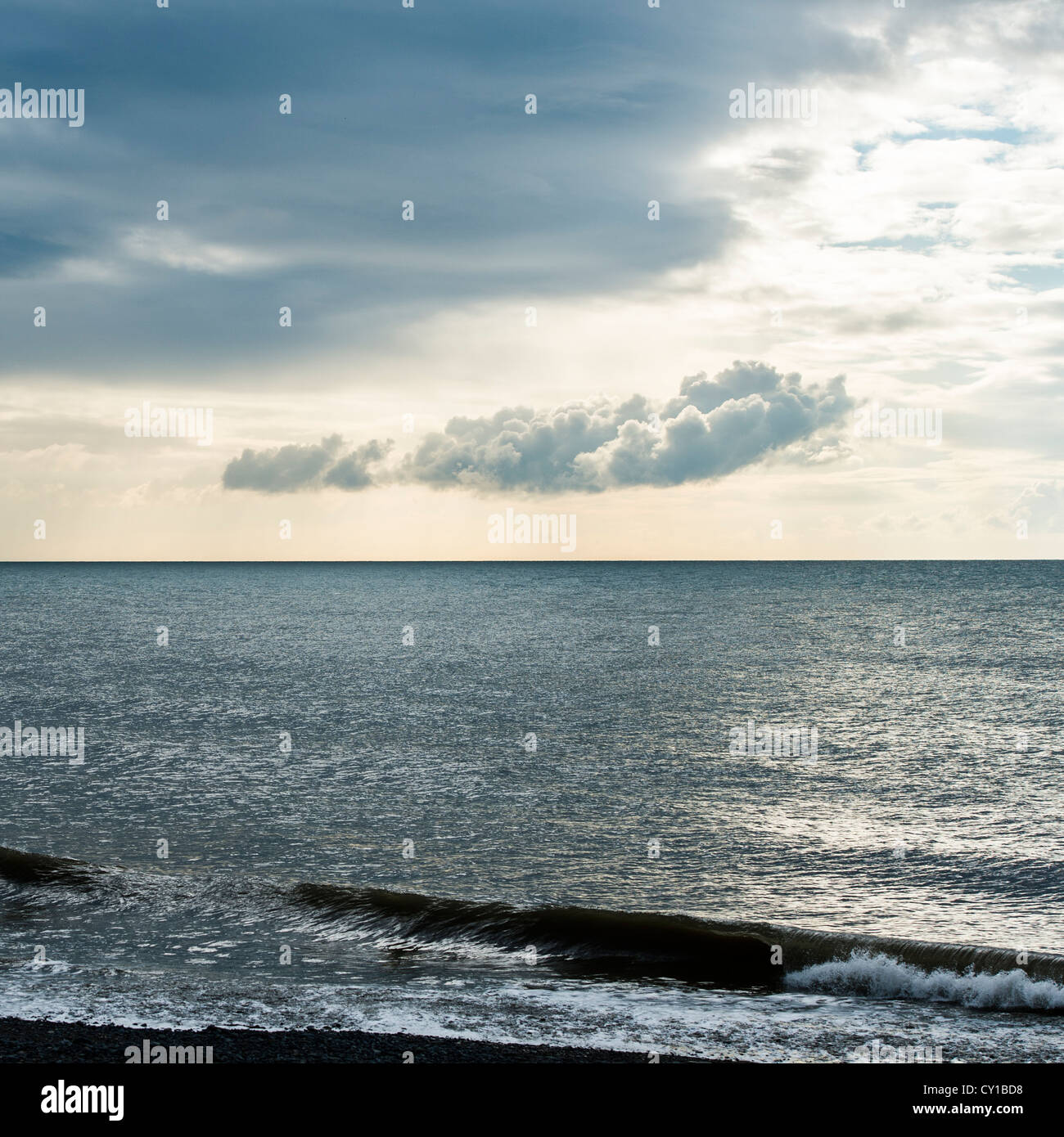 Clouds at dusk evening over Cardigan Bay sea seashore as seen from ...