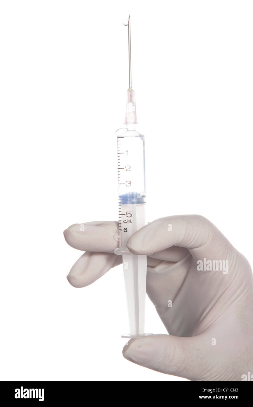 Hand holding syringe, on white background Stock Photo - Alamy