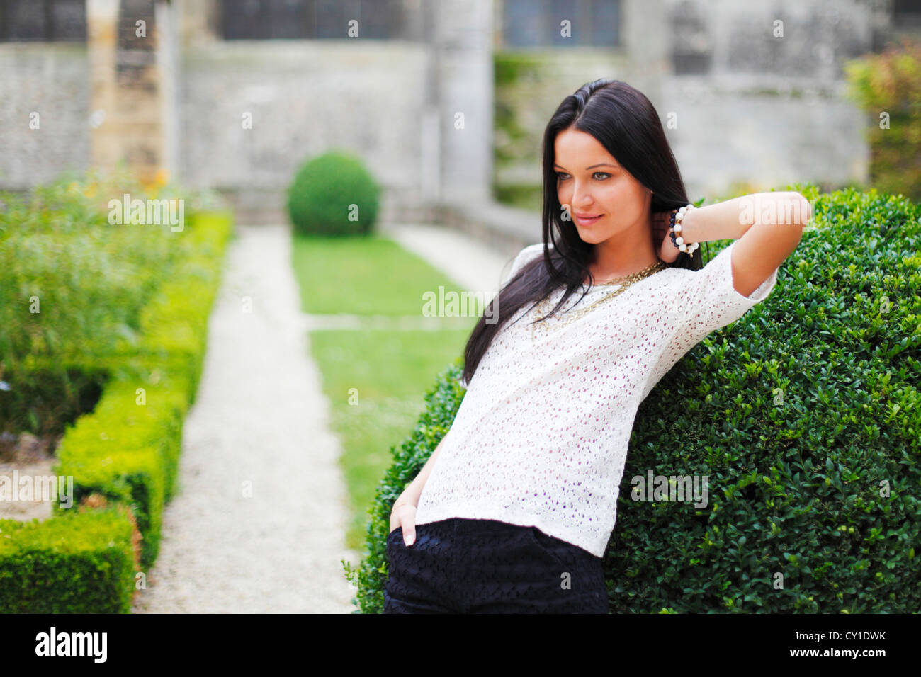 woman in cathedral park Stock Photo - Alamy