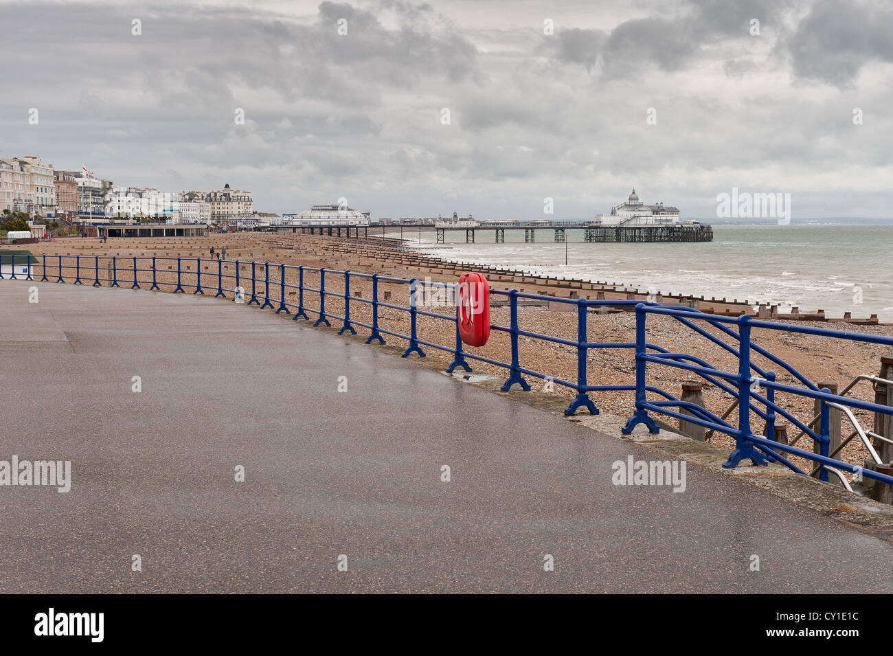 Overcast stormy and rainy day at Eastbourne with pier and wet coastal ...