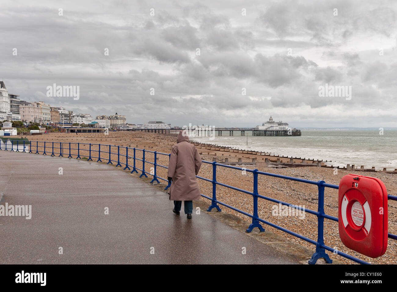 Overcast stormy and rainy day at Eastbourne with pier and wet coastal ...