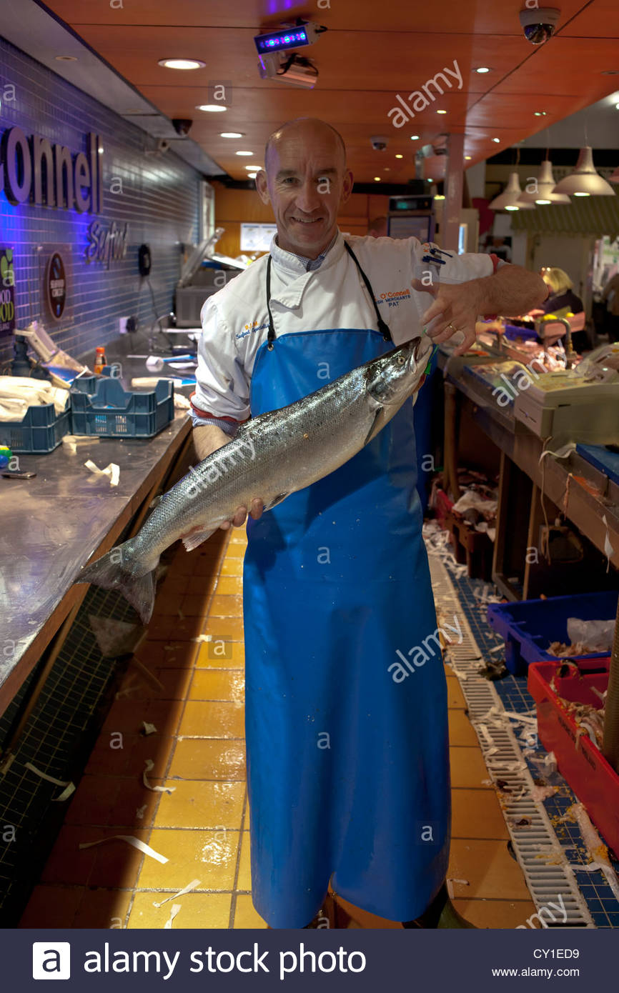 A fishmonger shows his wares Stock Photo - Alamy