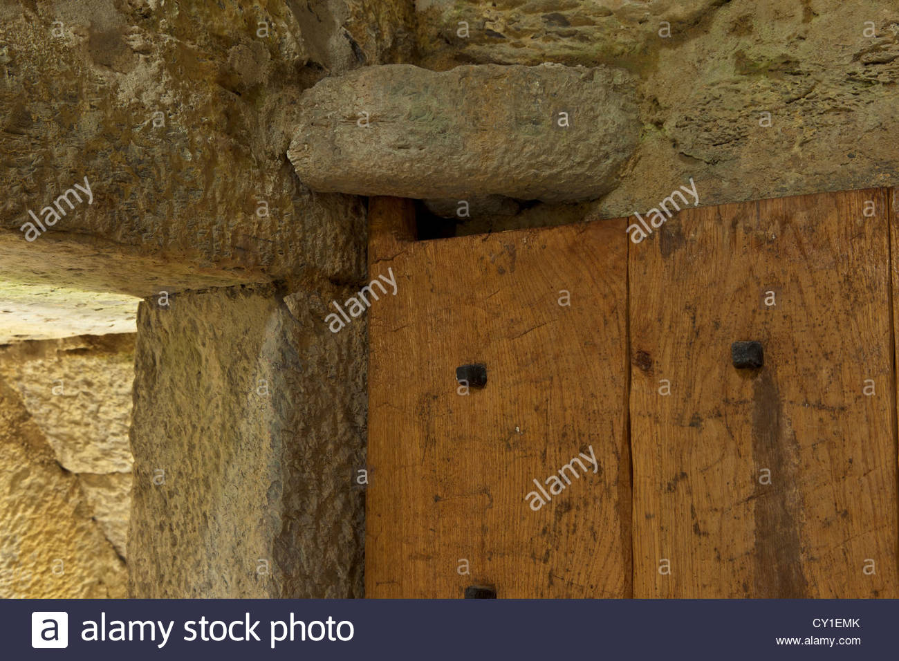 An ancient stone and wood hinge inside and Franciscan Abbey Stock Photo ...