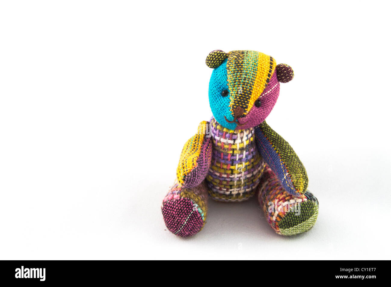 Handicraft colorful bear on a white background Stock Photo - Alamy