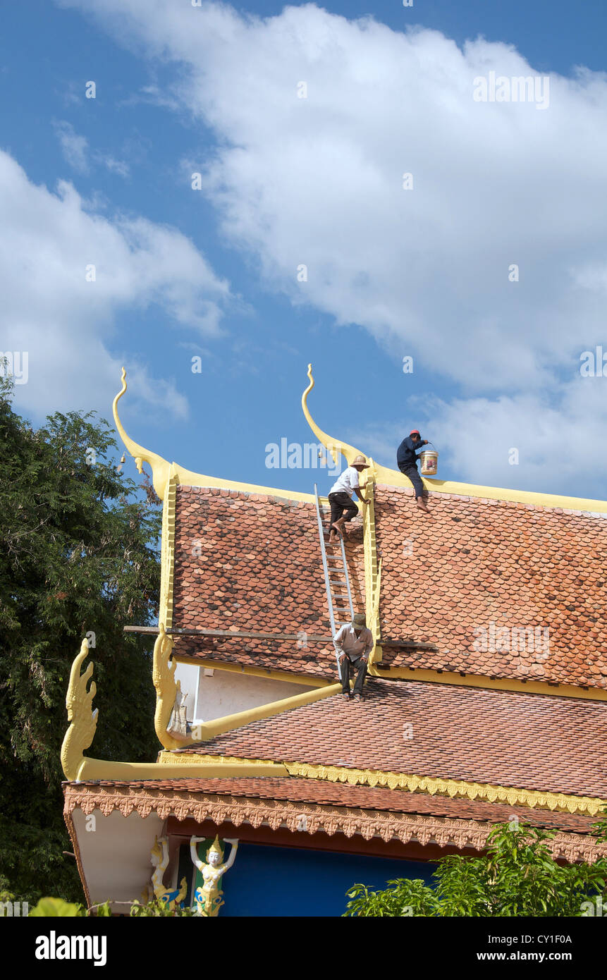 men working on roof of a temple Cambodia Asia Stock Photo - Alamy