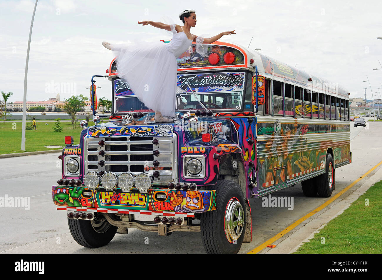 A ballerina balancing on top of a classical 'Red Devil' bus Stock Photo ...