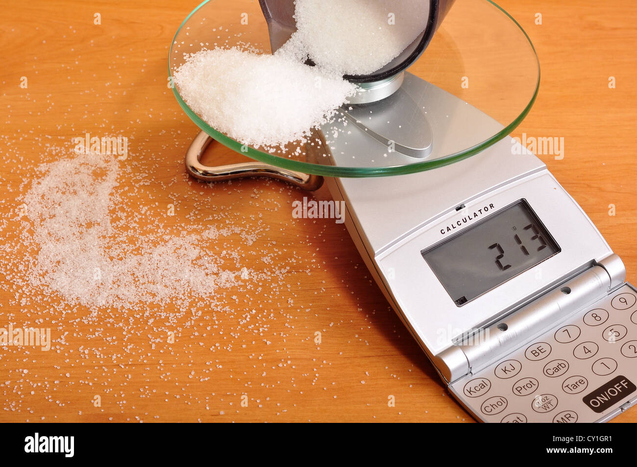 Photo of weighing sugar on scale Stock Photo - Alamy