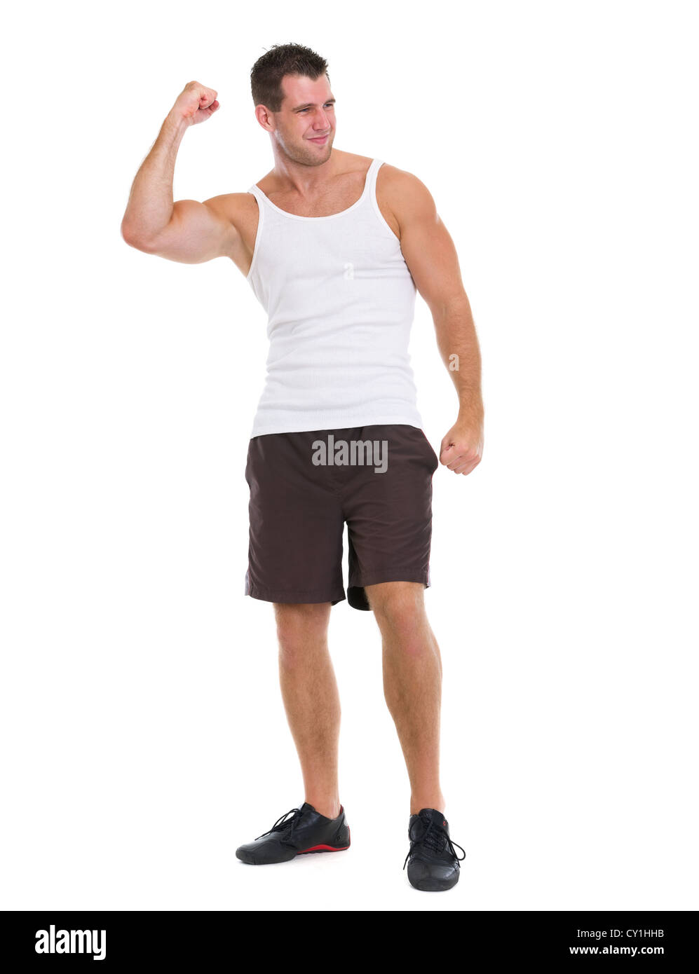 Happy muscular man rejoicing success Stock Photo - Alamy
