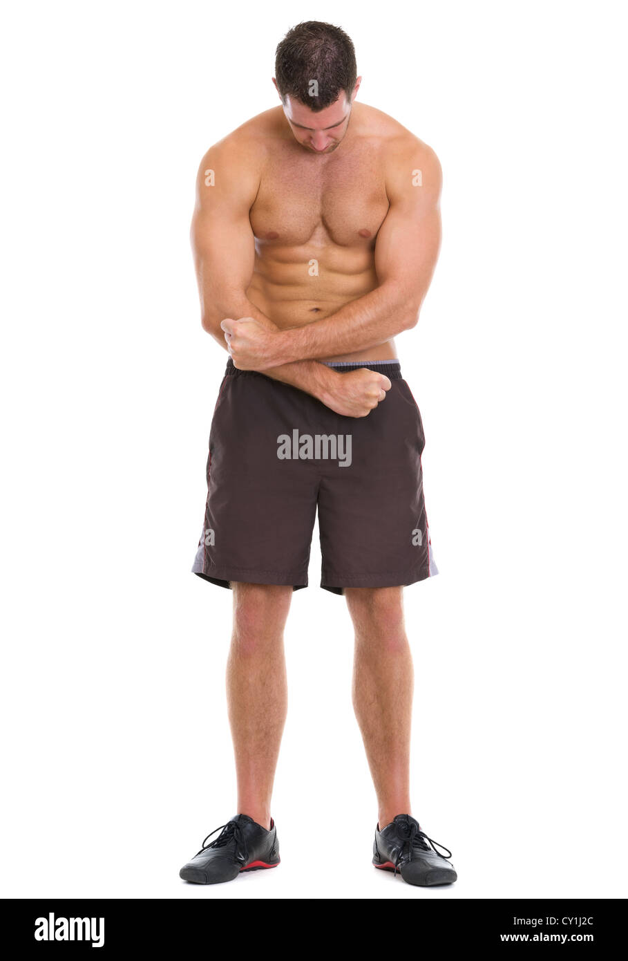 Full length portrait of muscular sportsman showing muscles Stock Photo ...