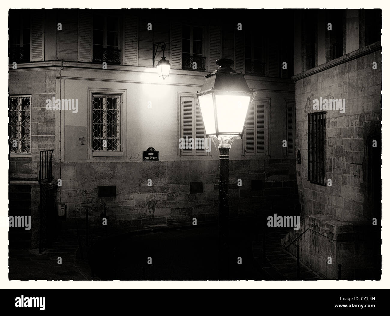 Paris back street at night with street light Stock Photo - Alamy